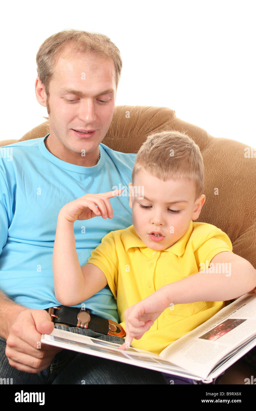 father with boy reading book Stock Photo - Alamy