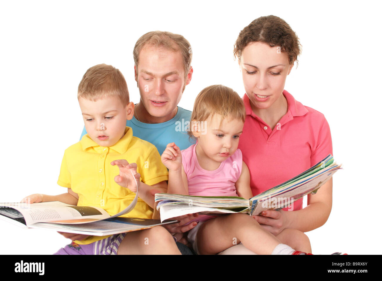 family of four read books Stock Photo - Alamy