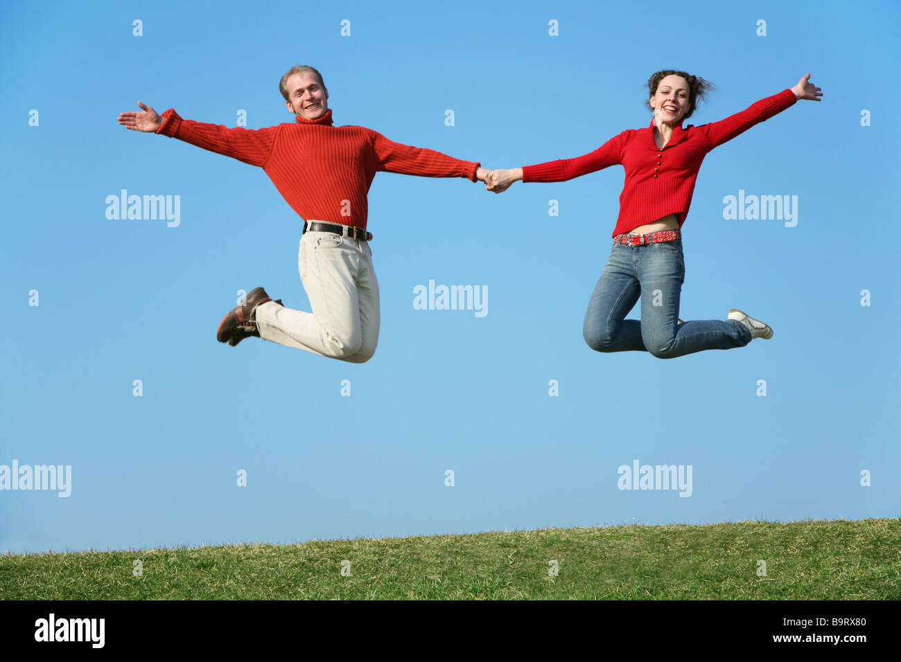 jumping couple 2 Stock Photo - Alamy
