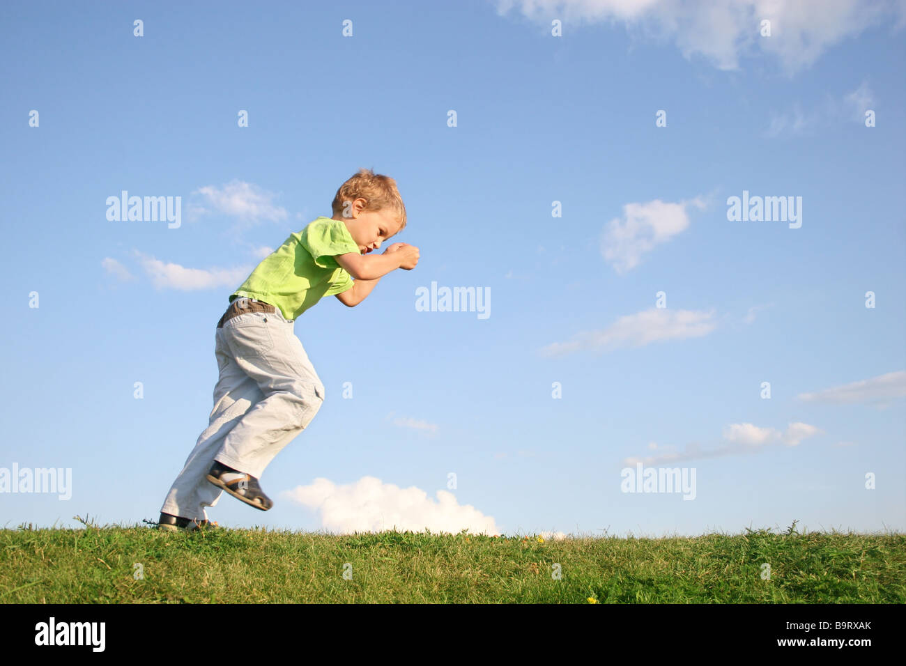 starting boy on meadow Stock Photo - Alamy