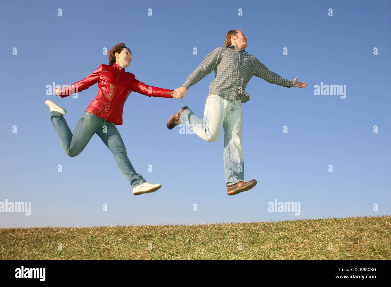 run fly jump couple 3 Stock Photo - Alamy