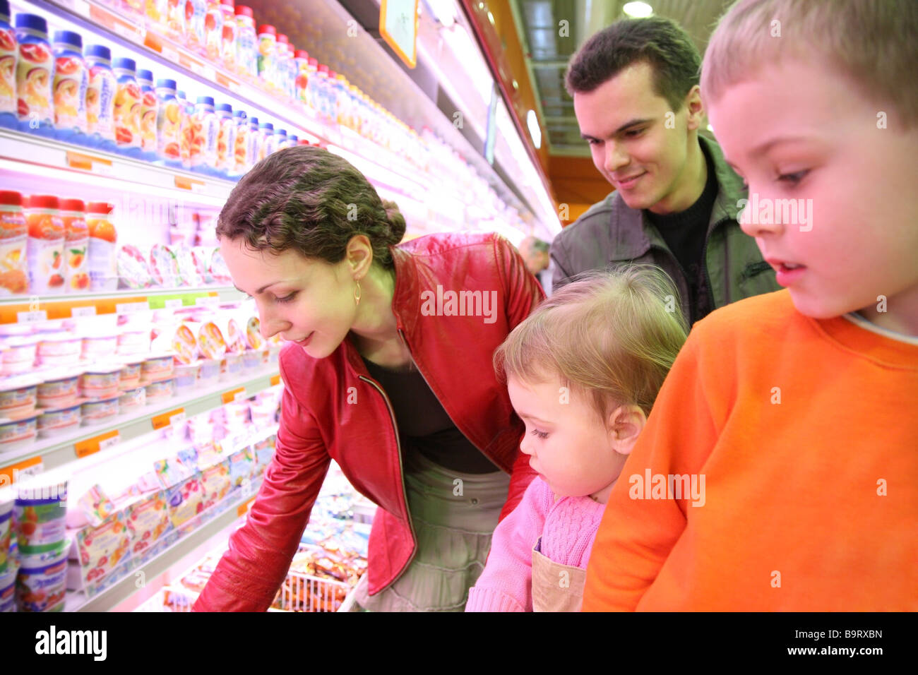 family in food shop Stock Photo - Alamy