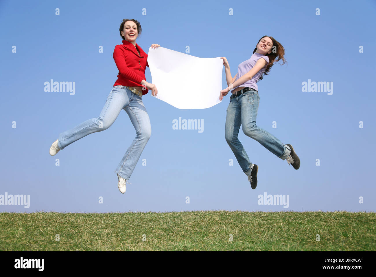jump girls with paper Stock Photo - Alamy