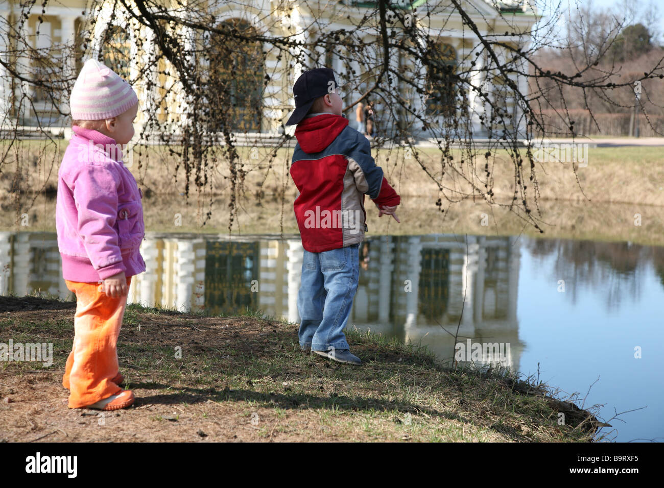 Children by the pond hi-res stock photography and images - Alamy