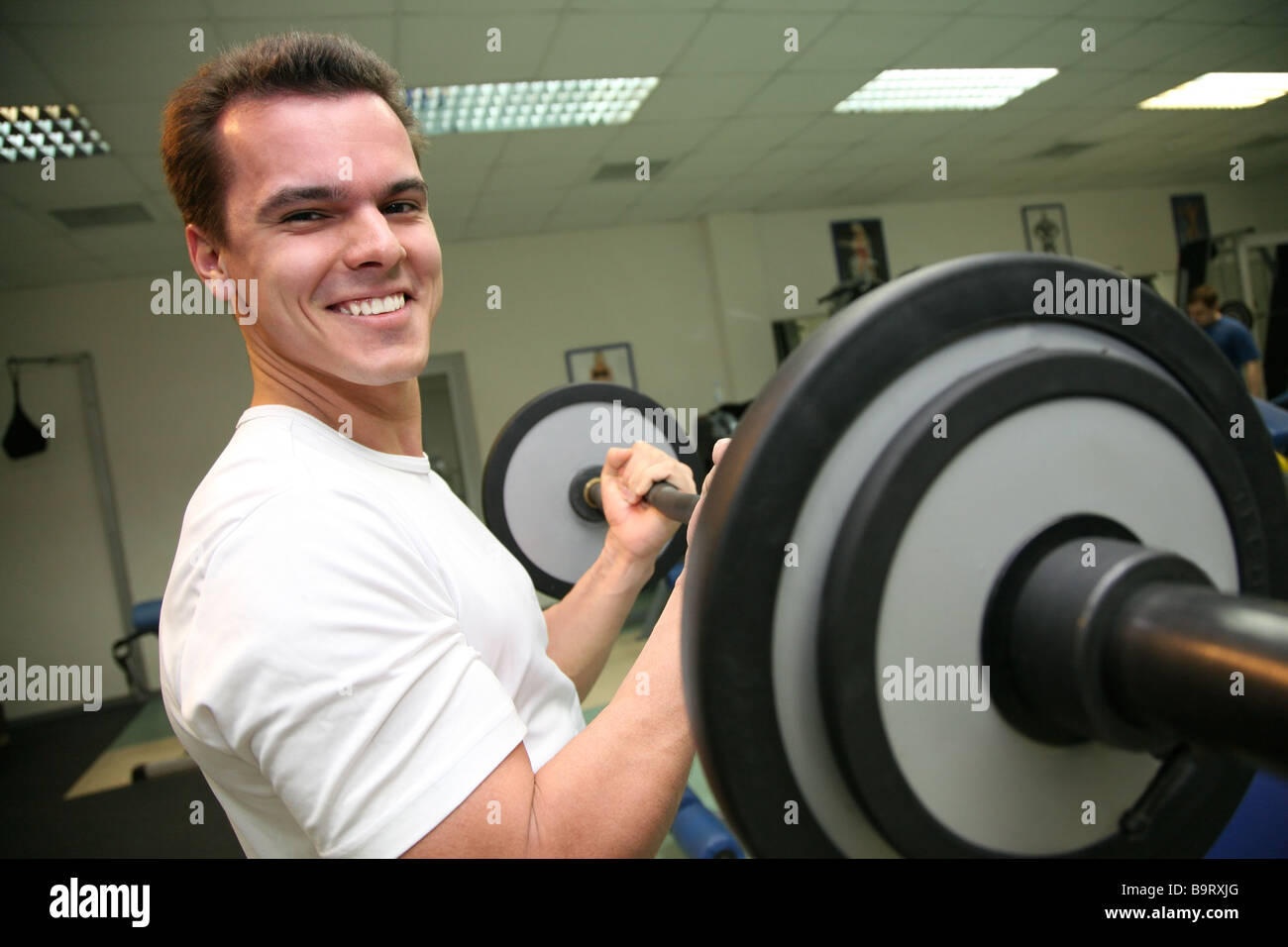 gym man with barbell 2 Stock Photo - Alamy