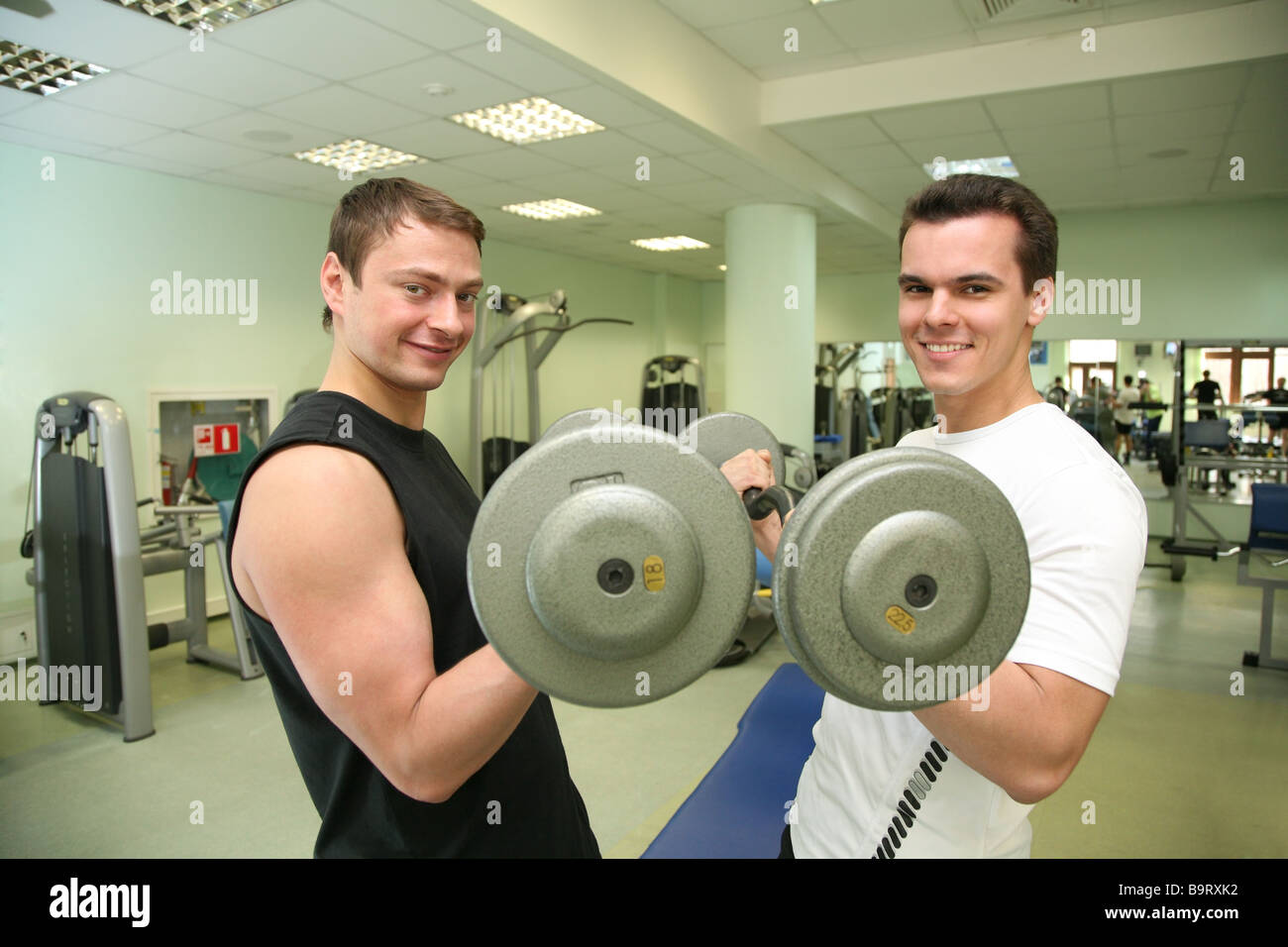 gym boys with dumbbells Stock Photo - Alamy