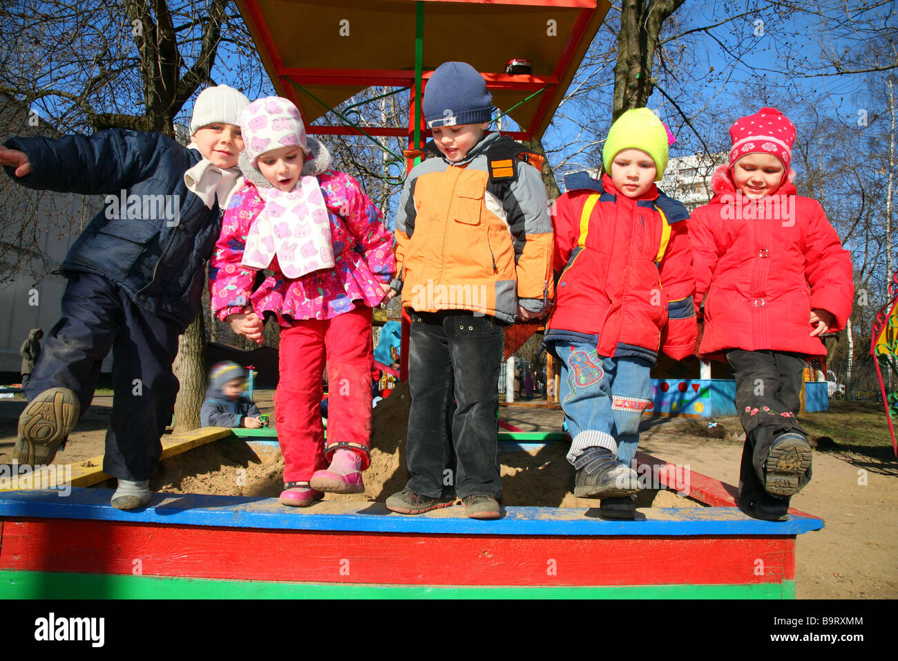team with leg up in kindergarten Stock Photo - Alamy