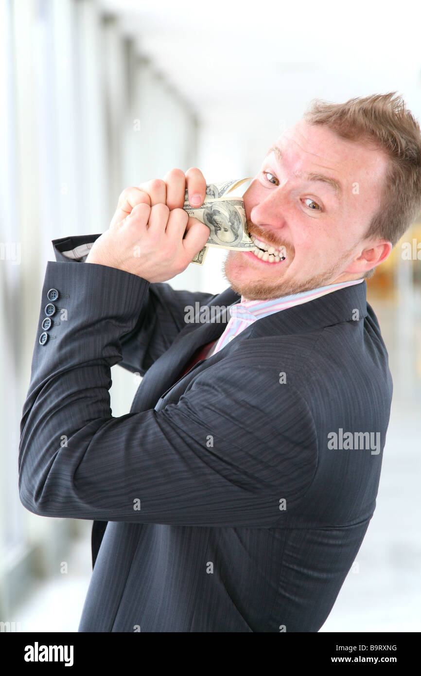 hungry angry businessman with money Stock Photo - Alamy