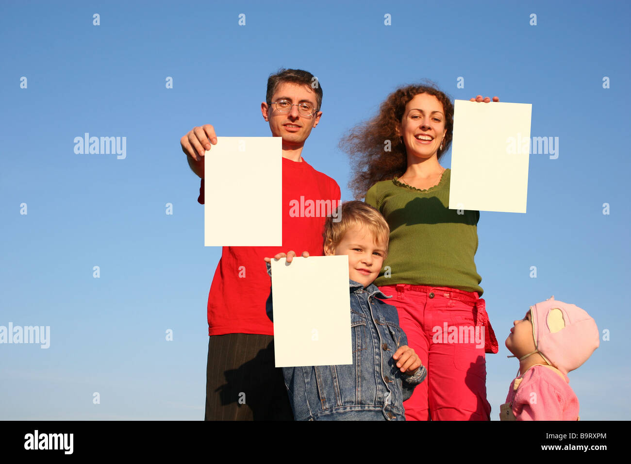 family with cards for text Stock Photo - Alamy