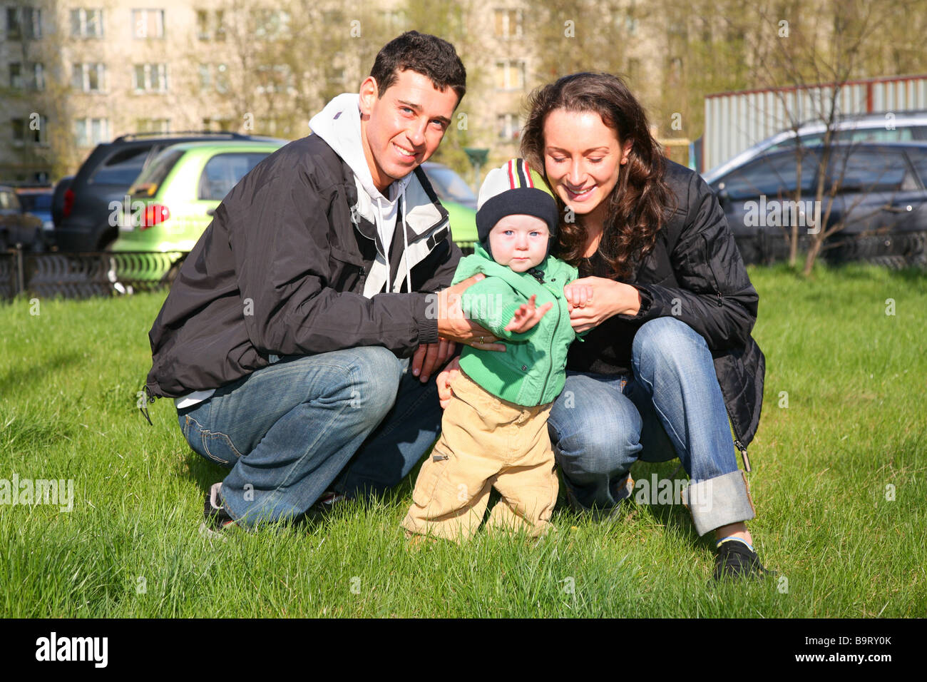 spring family with baby in yard Stock Photo - Alamy