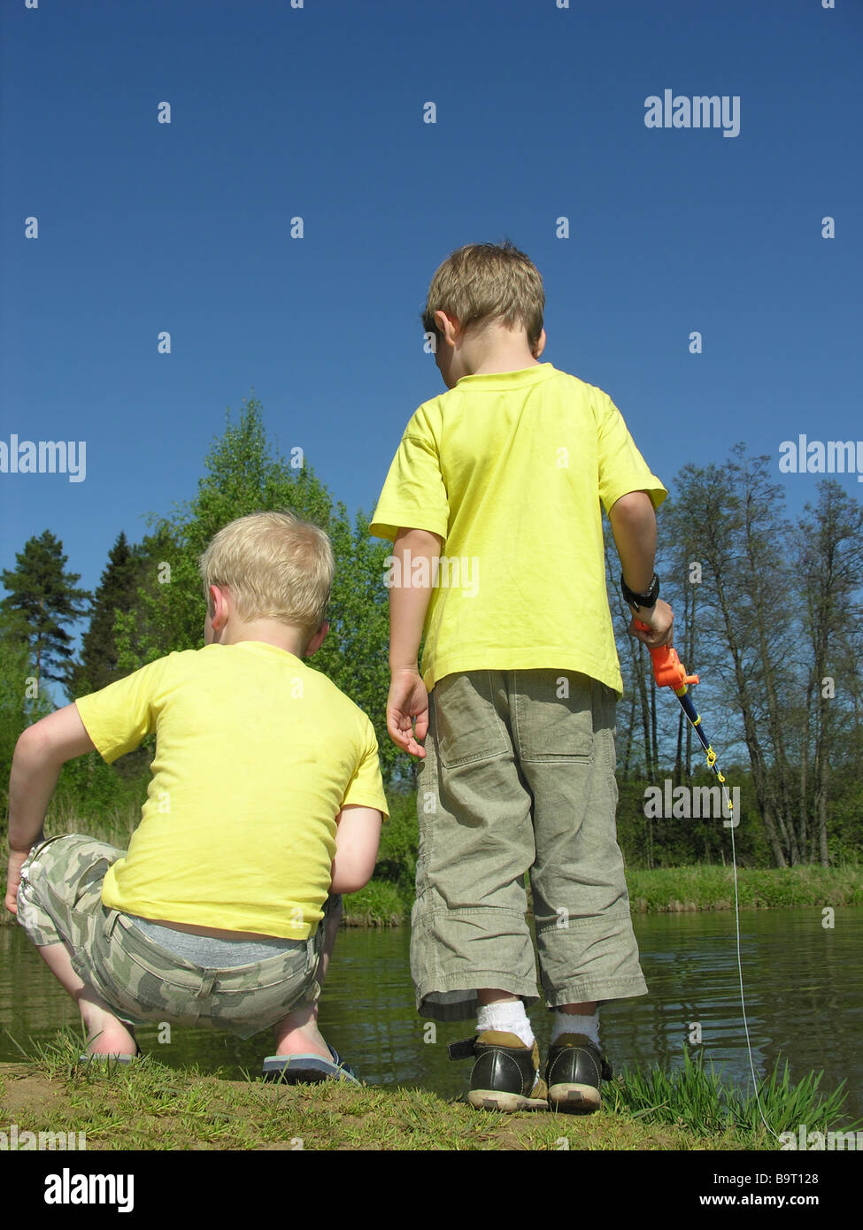 children on pond Stock Photo - Alamy