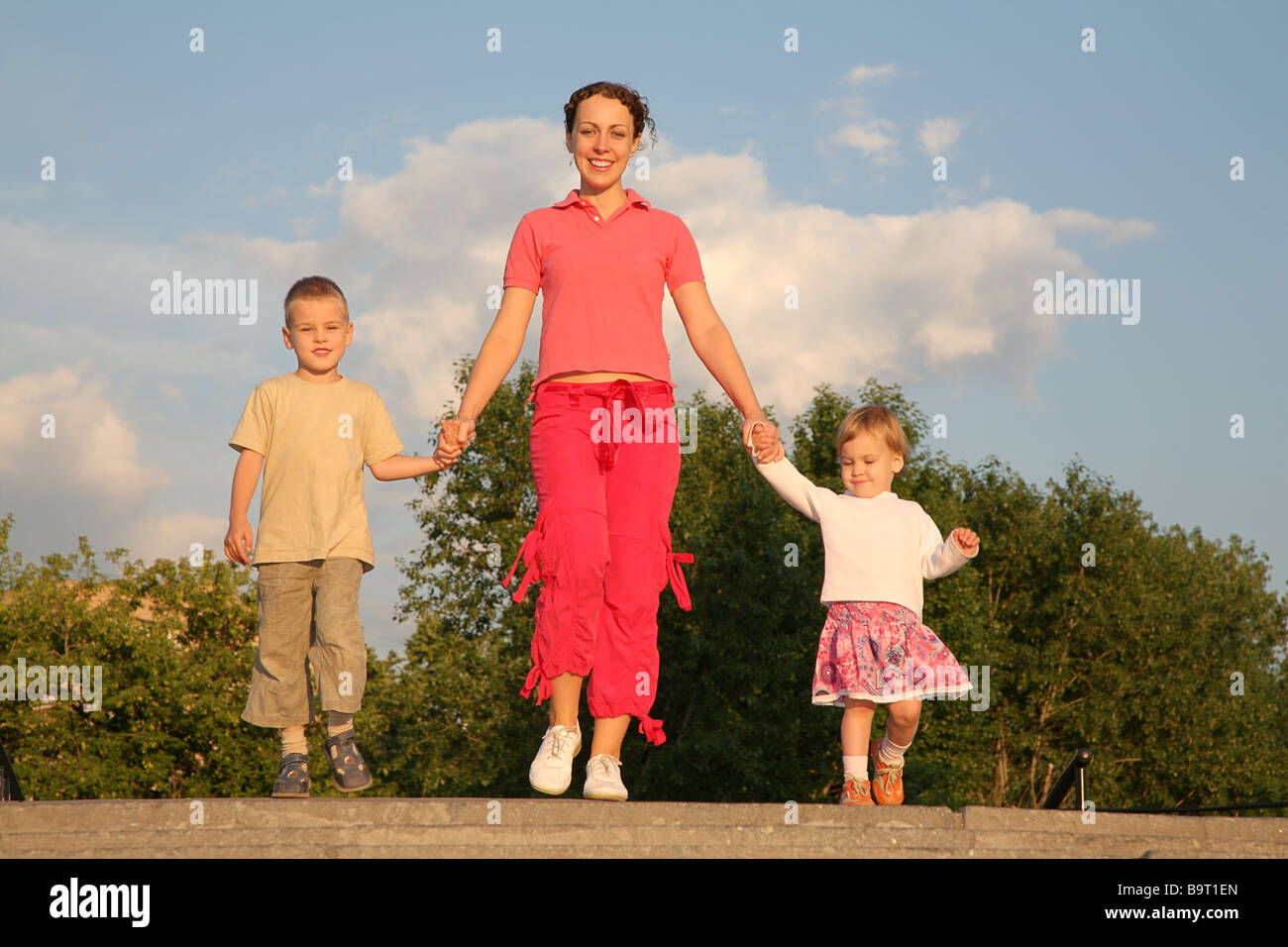 Mother walks with children Stock Photo - Alamy