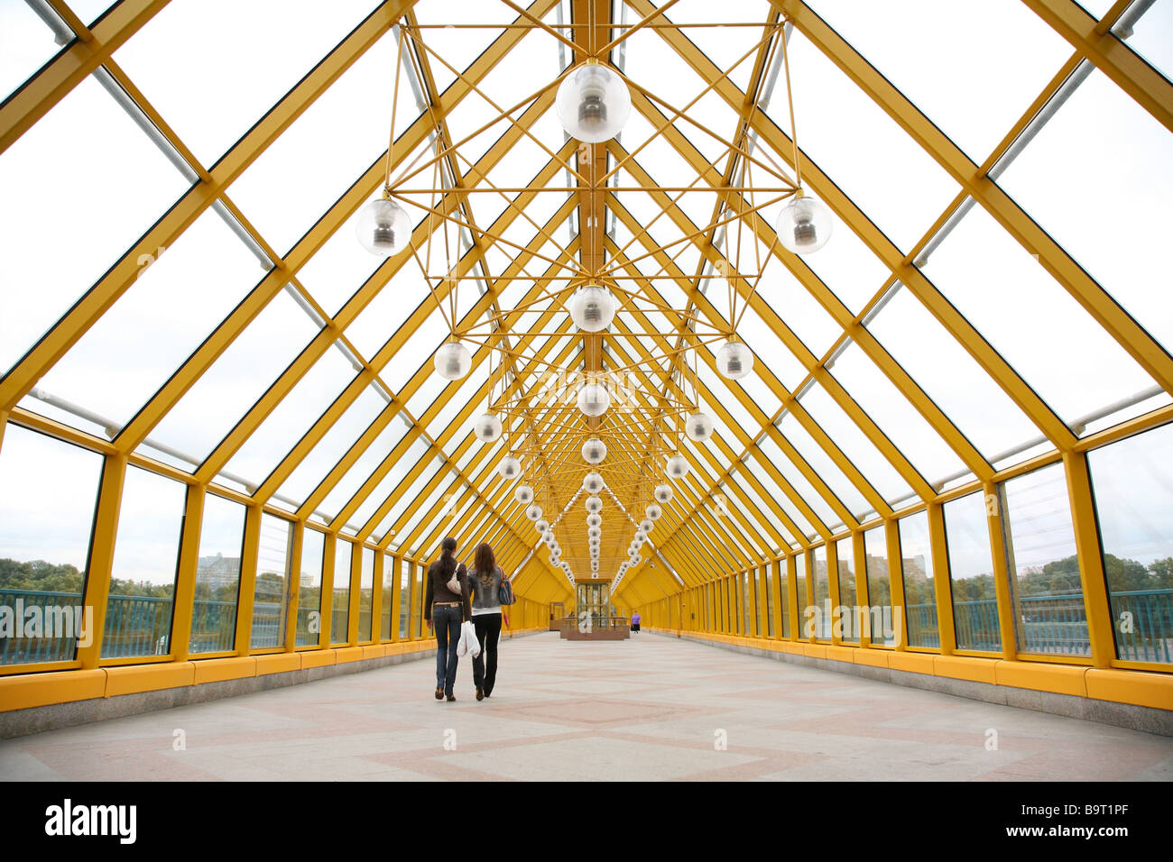 Pedestrians on pedestrian bridge Stock Photo - Alamy