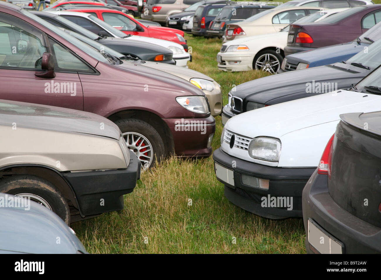 many cars on the grass Stock Photo - Alamy