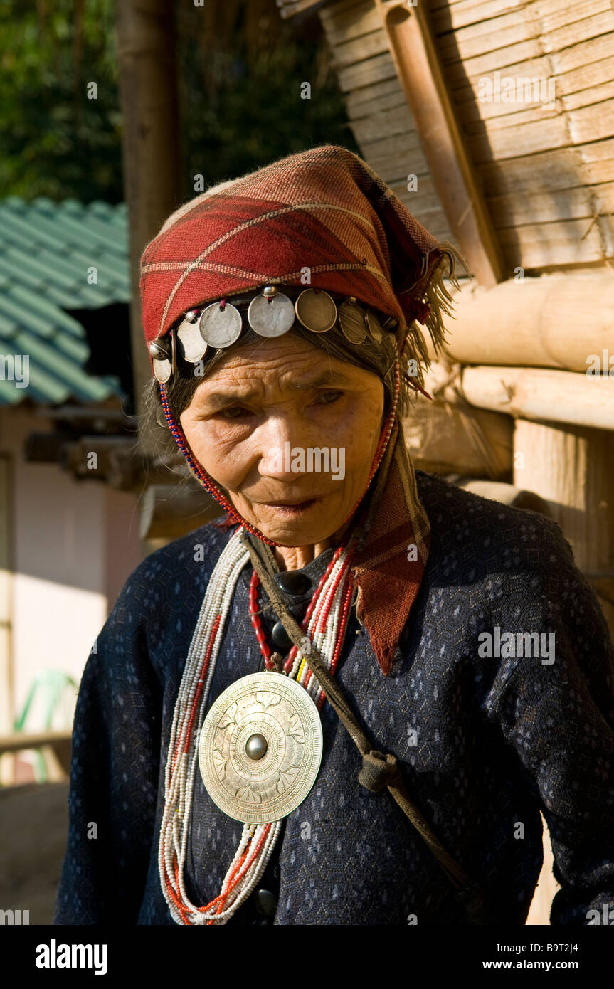Portrait of An Akha woman wearing a traditional head wear and dress ...
