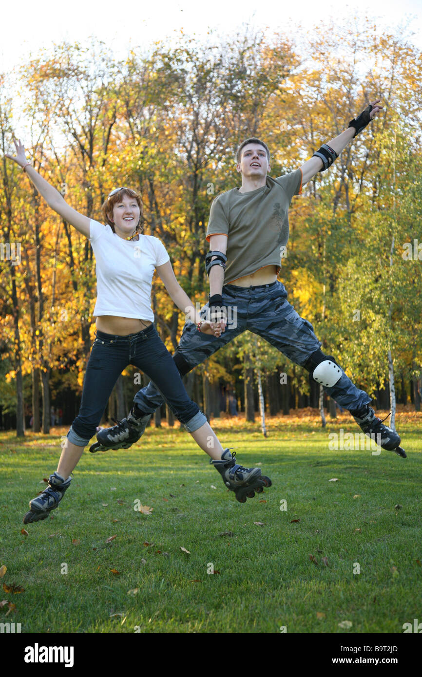young roller couple jump Stock Photo - Alamy