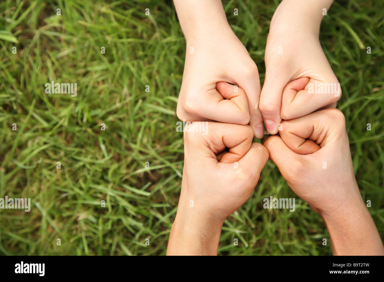 Joined fists hi-res stock photography and images - Alamy