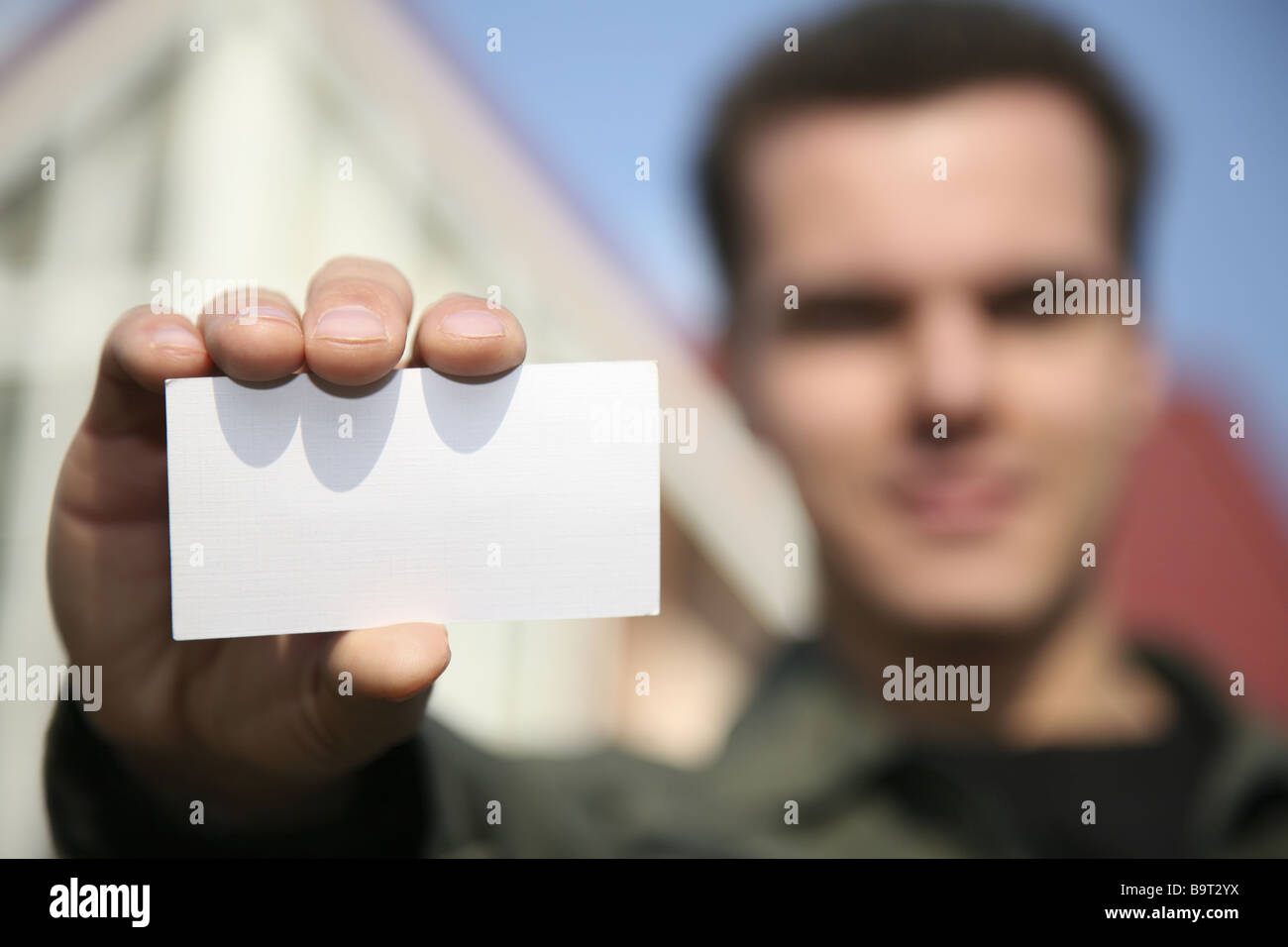 man holding card Stock Photo - Alamy