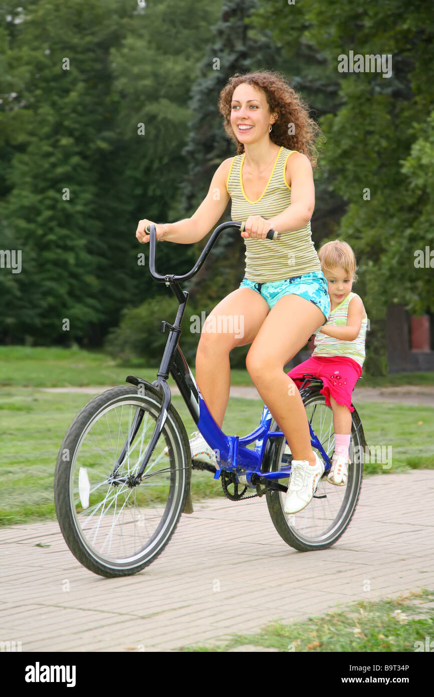 Mother and daughter ride on bicycle Stock Photo - Alamy