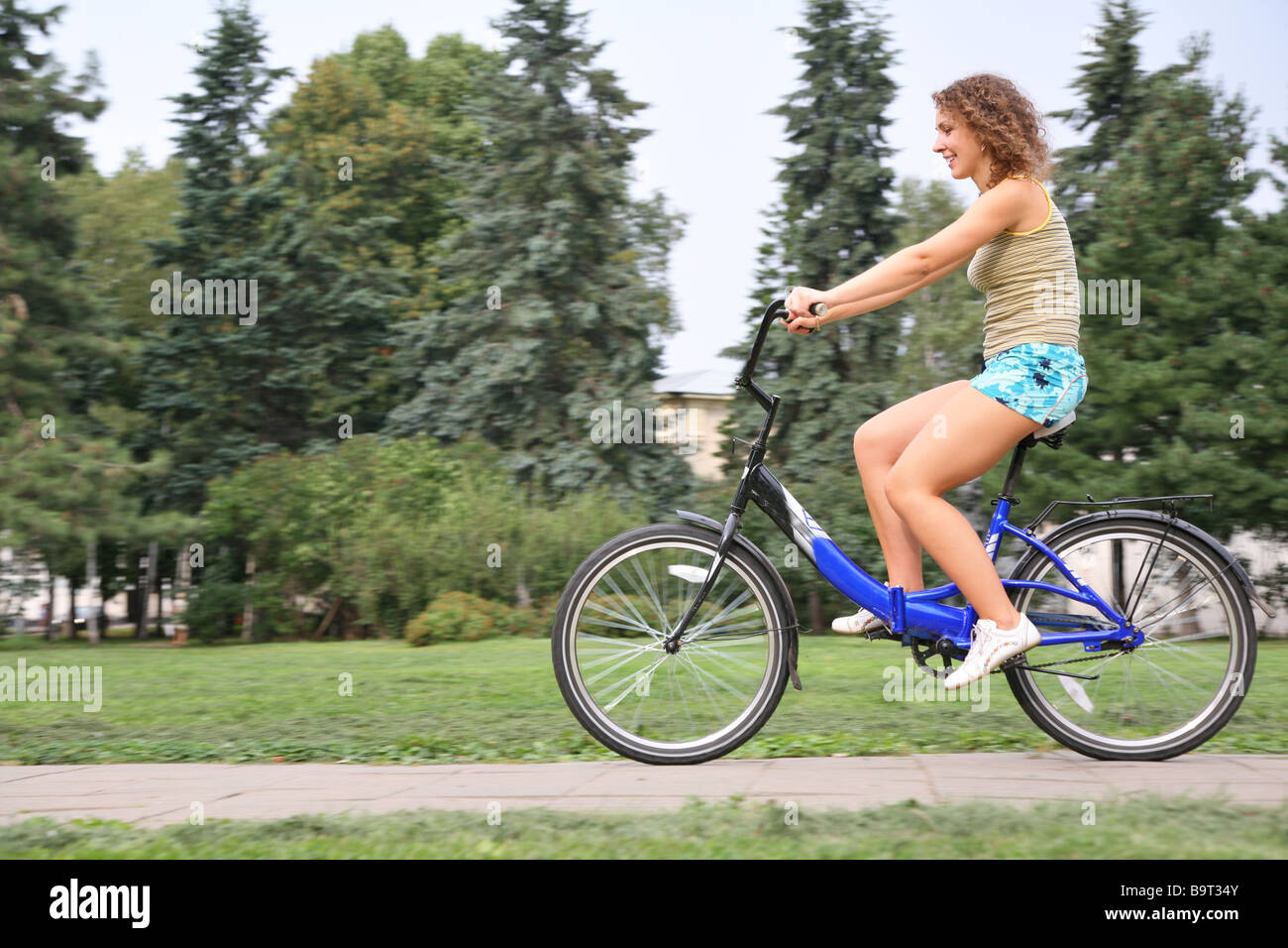 young woman on bicycle Stock Photo - Alamy