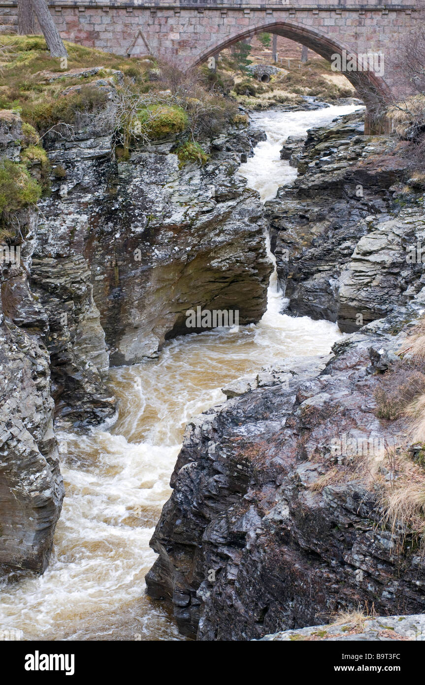 Surging waters pass through the narrow rocky gorge of the Linn of Dee ...