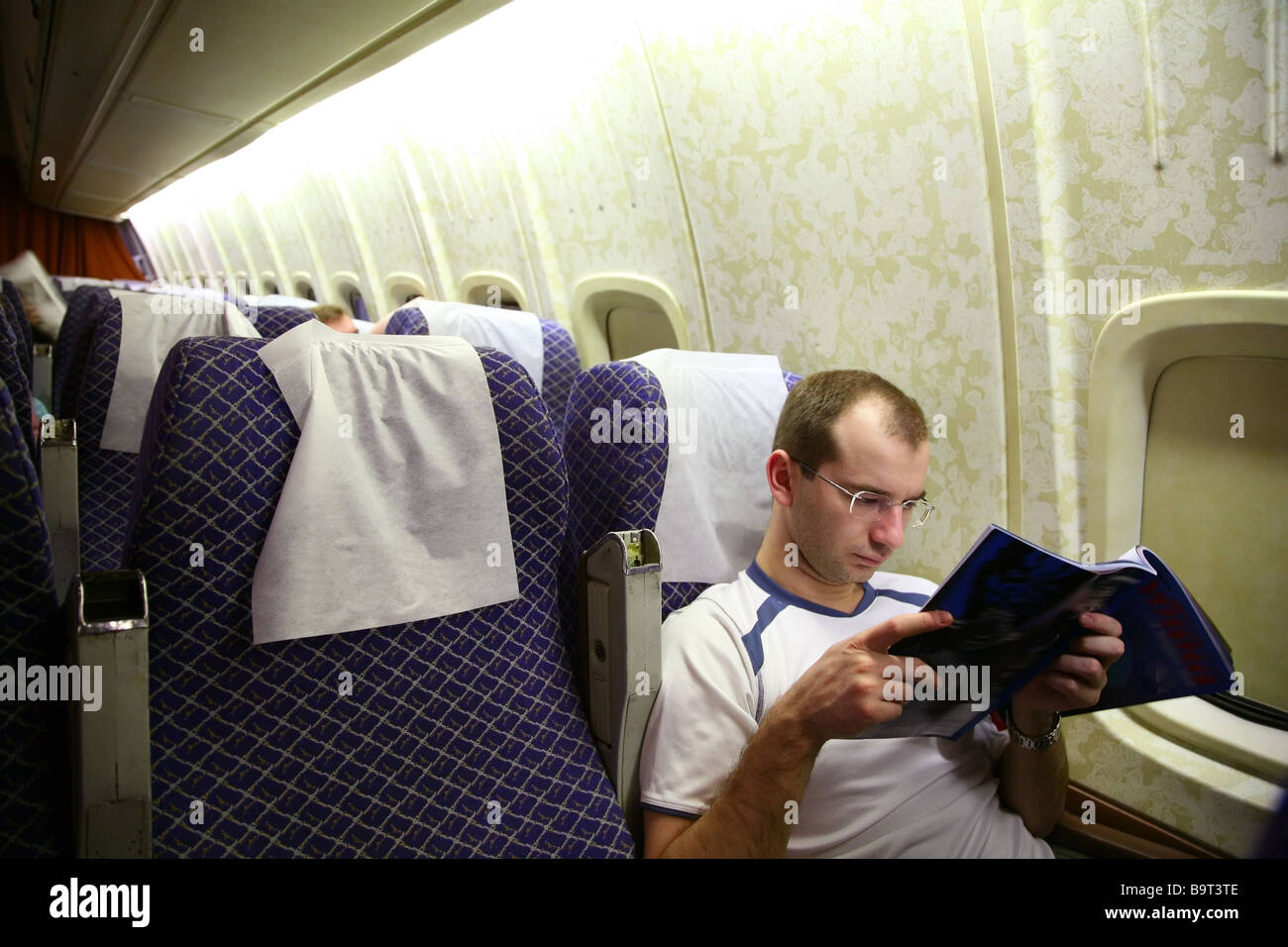 man airplane journal Stock Photo - Alamy