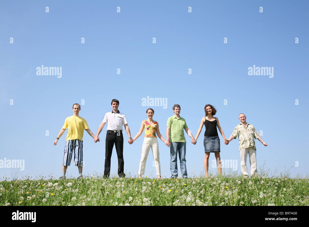 friends chain on grass Stock Photo - Alamy
