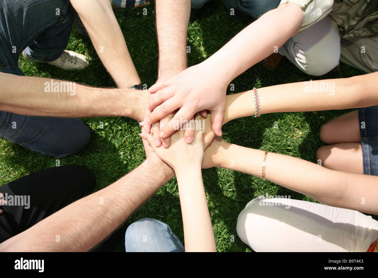 Friends have combined hands together Stock Photo - Alamy