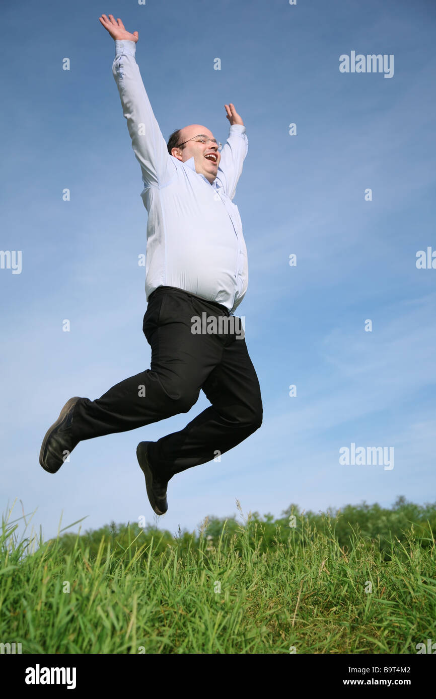 man jumping grass Stock Photo - Alamy