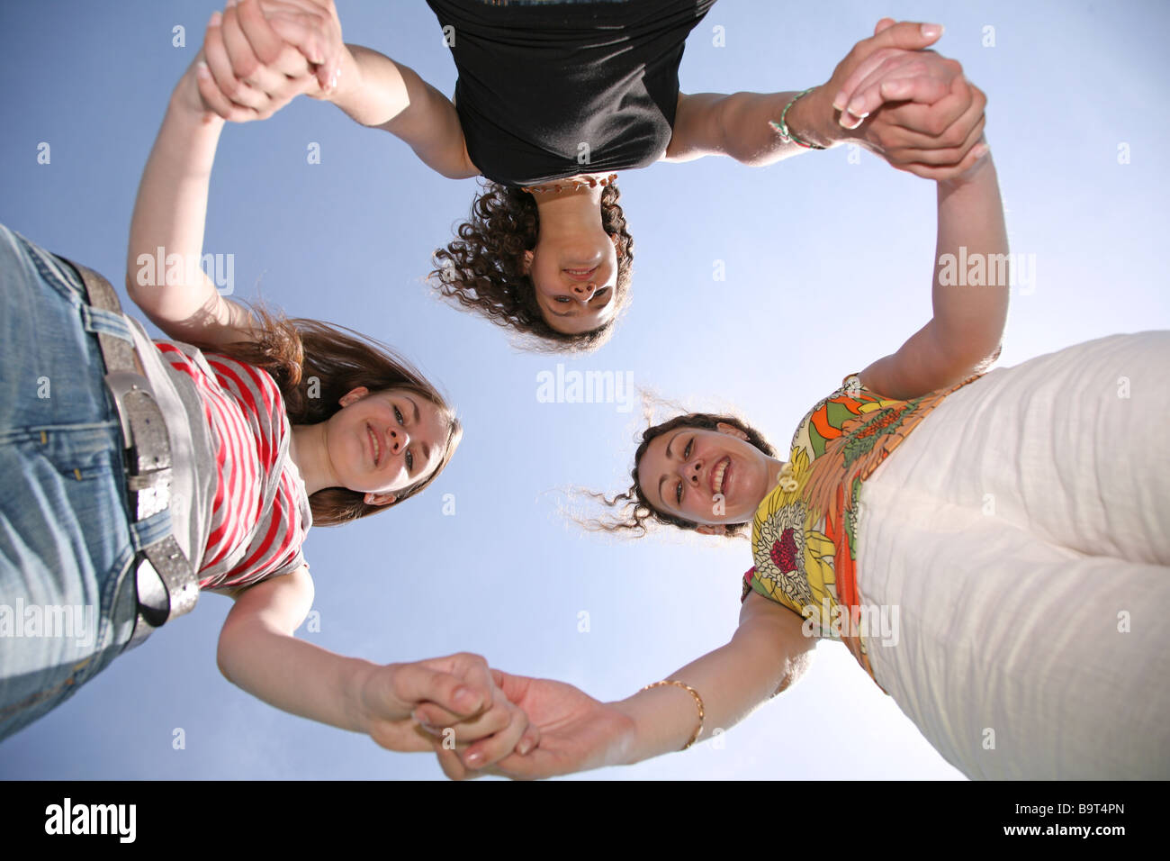 Three people in a circle hi-res stock photography and images - Alamy