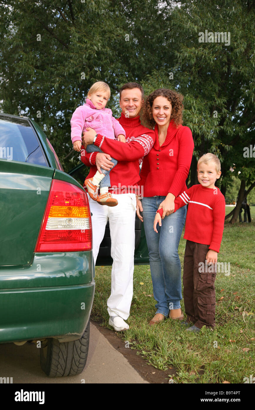 family stand near car Stock Photo - Alamy
