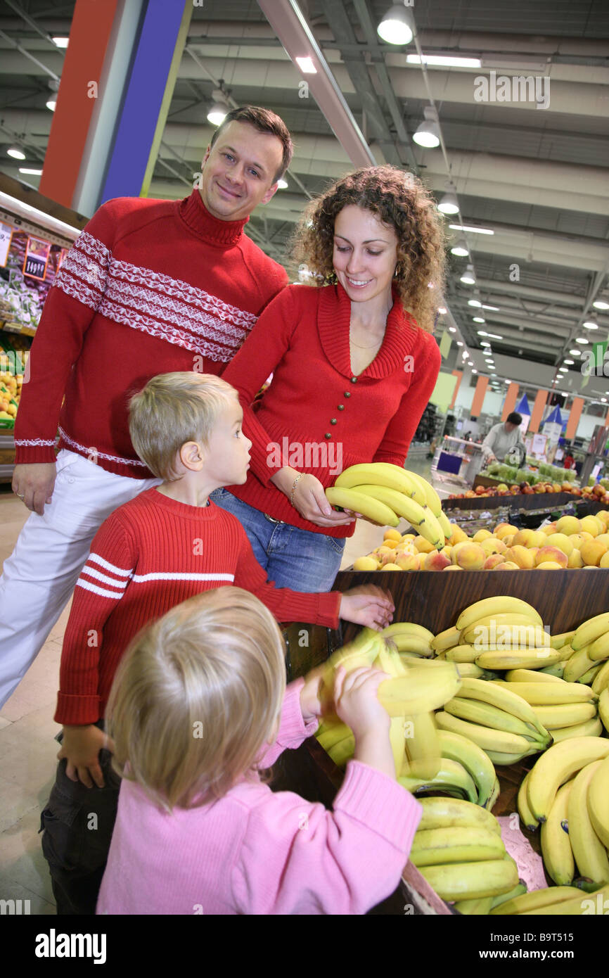 parents with child in shop Stock Photo - Alamy