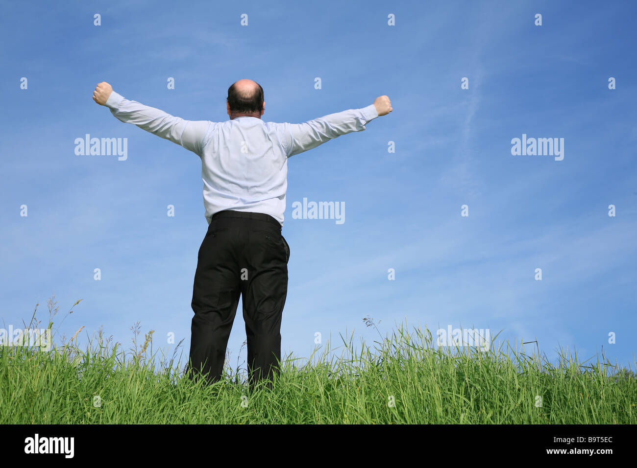 behind fatman on grass Stock Photo - Alamy