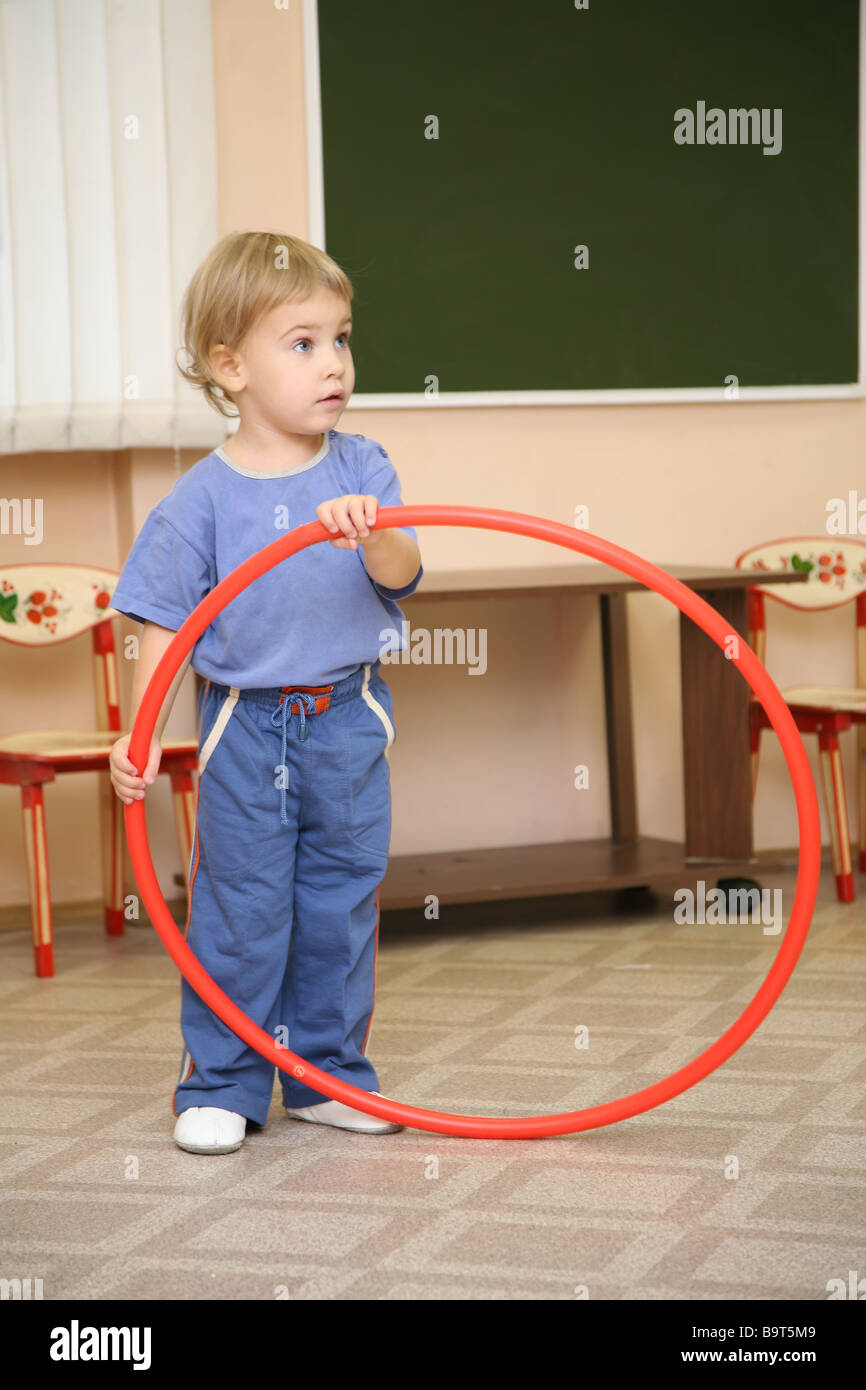 little girl play with hoop Stock Photo - Alamy