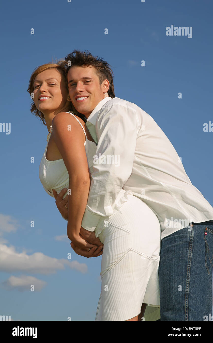 man embraces the young woman Stock Photo - Alamy