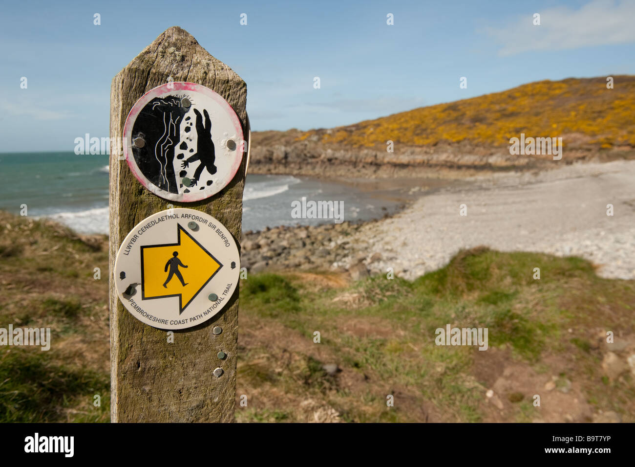 Footpath sign and dangerous cliffs warning at Aber Bach beach ...