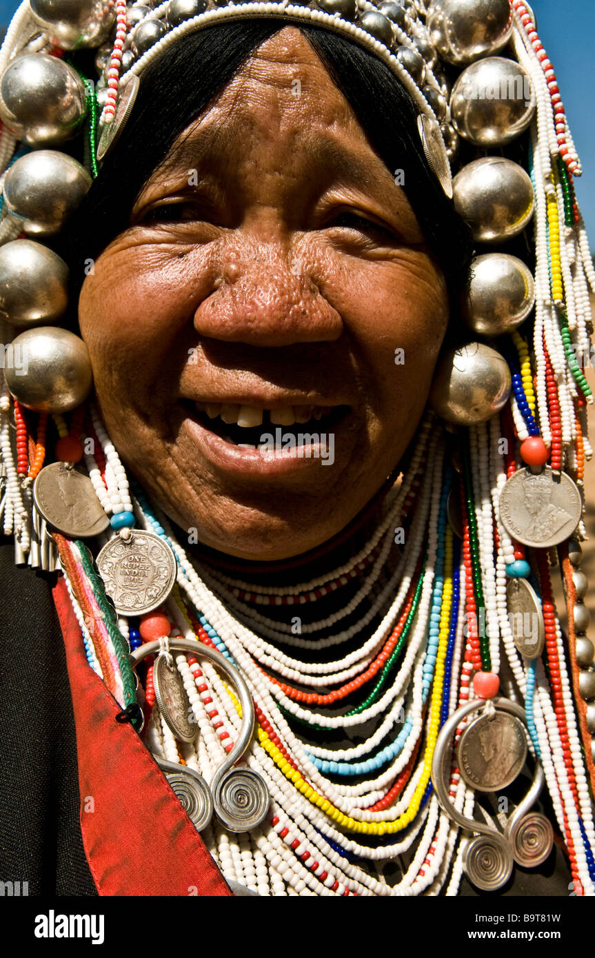 Portrait of An Akha woman wearing a traditional head wear and dress ...