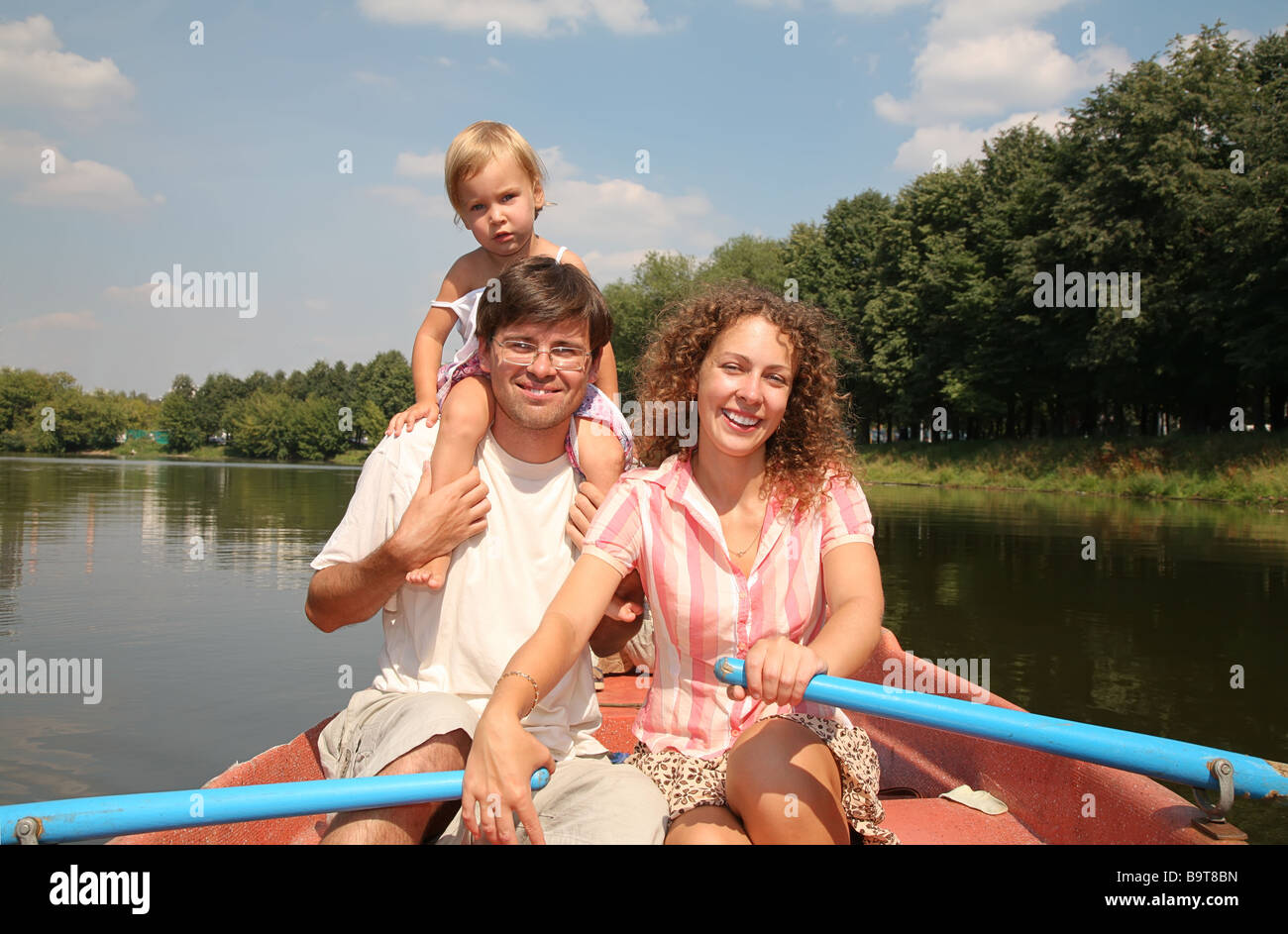 family at the lake in the boat 2 Stock Photo - Alamy