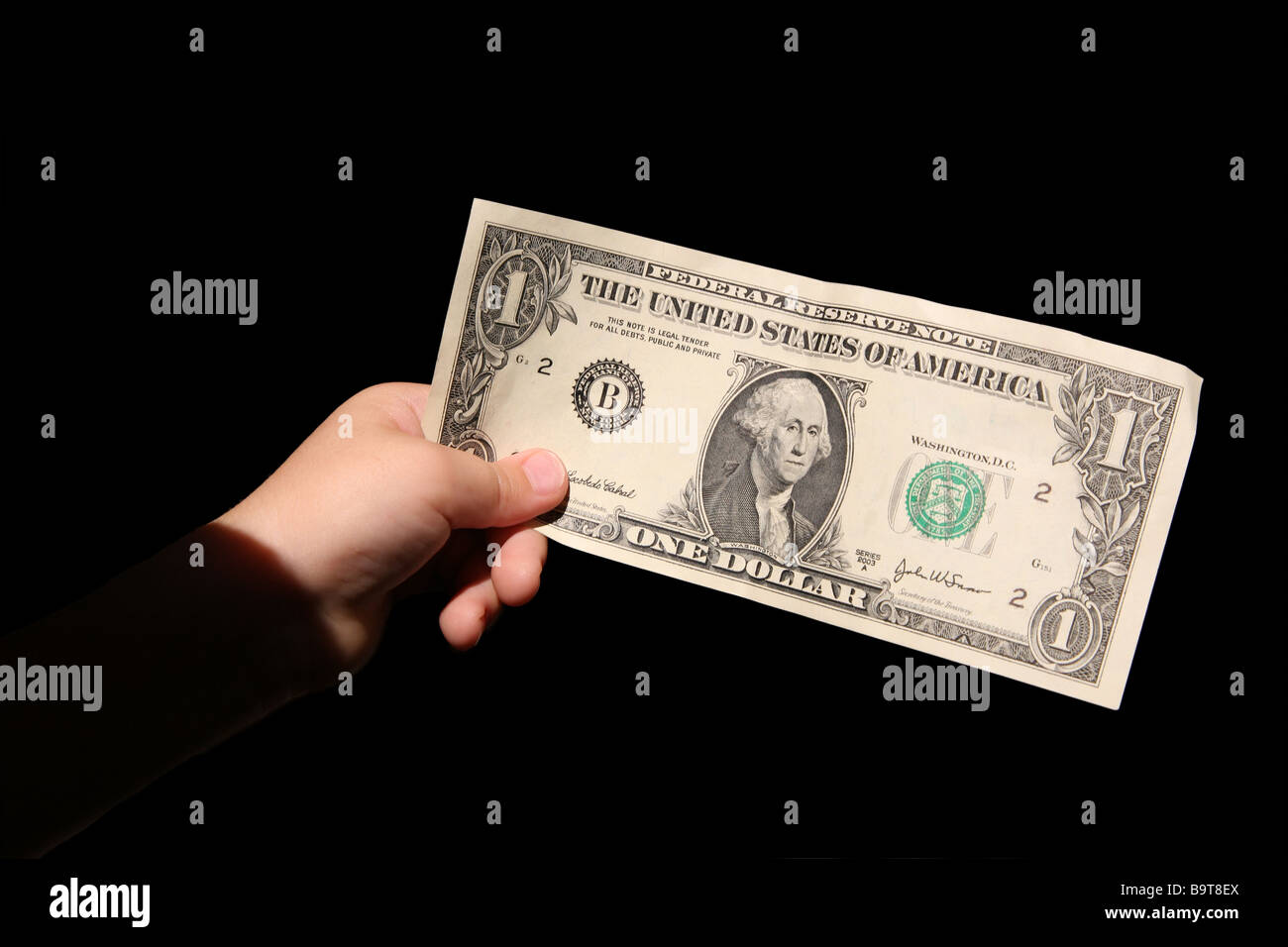 hand and one dollar isolated on black backgrounds Stock Photo - Alamy