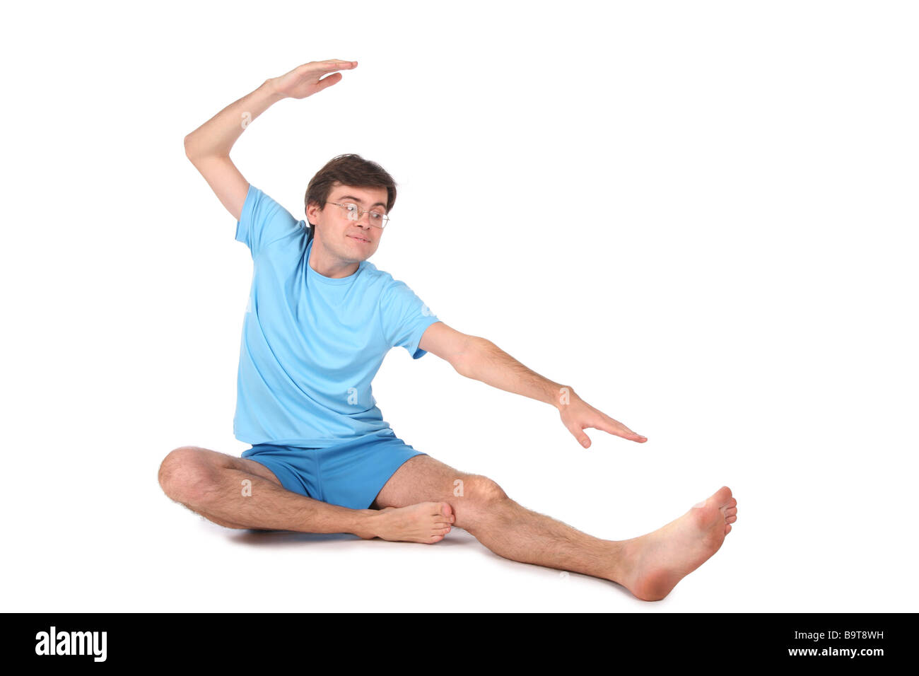 stretching yoga man Stock Photo - Alamy