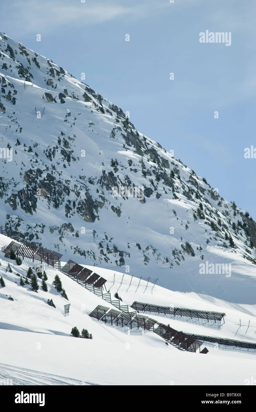 avalanche protection barriers on steep snow covered hillside French ...