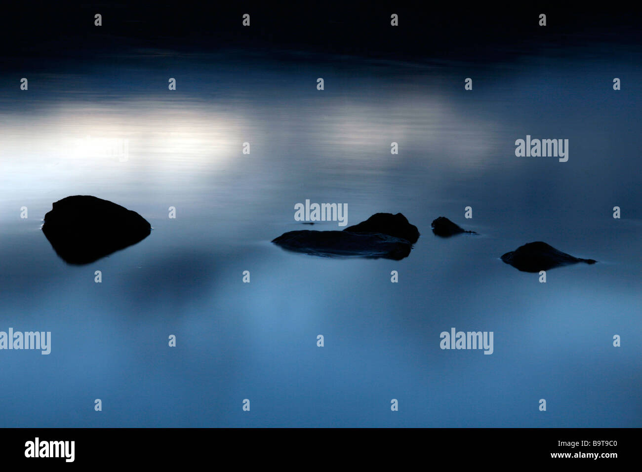 Three rocks at sunset Stock Photo - Alamy