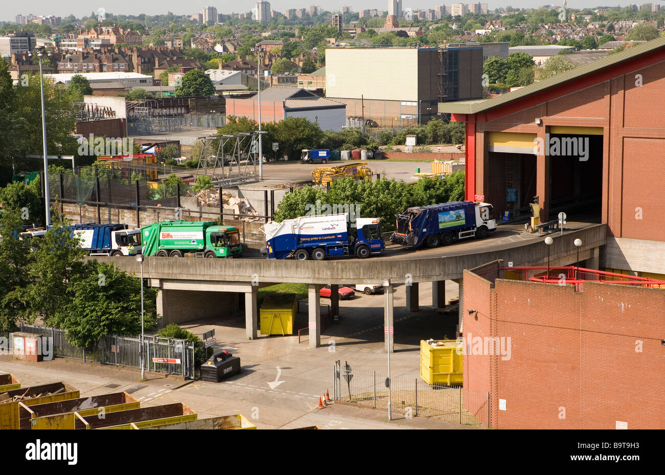 Bin lorries or garbage trucks at refuse processing centre in South ...