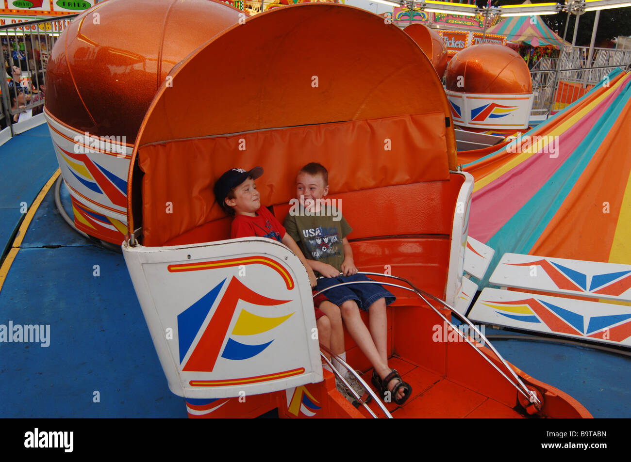Two boys in the tilt-a-whirl amusement park ride at the Dutchess County ...