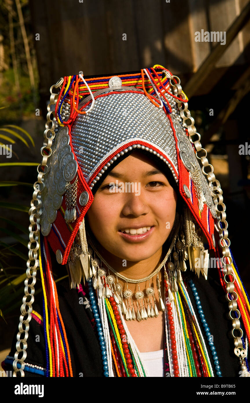 Portrait of An Akha woman wearing a traditional head wear and dress ...