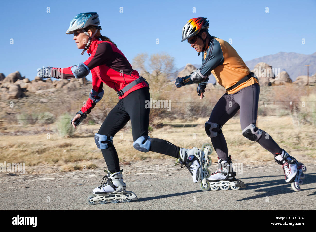 Couple roller blading Stock Photo - Alamy
