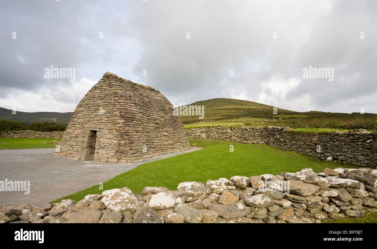 Gallarus Oratory with Wall. Gallarus Oratory under a threatening sky ...