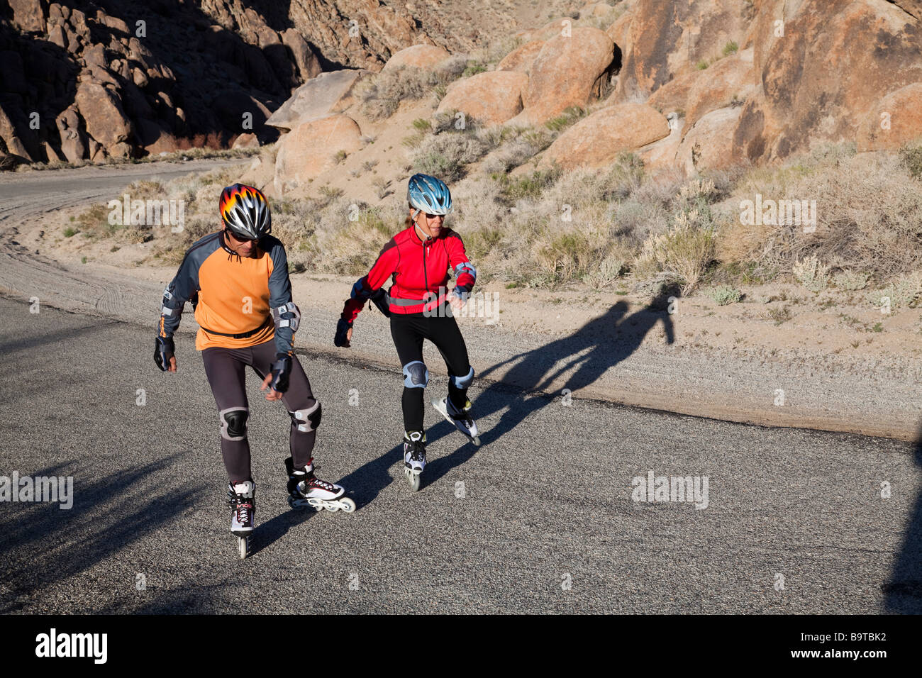 Couple roller blading Stock Photo - Alamy