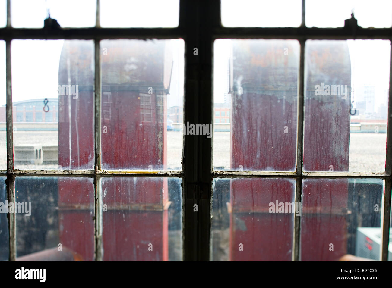 Window view out old factory or warehouse Stock Photo - Alamy