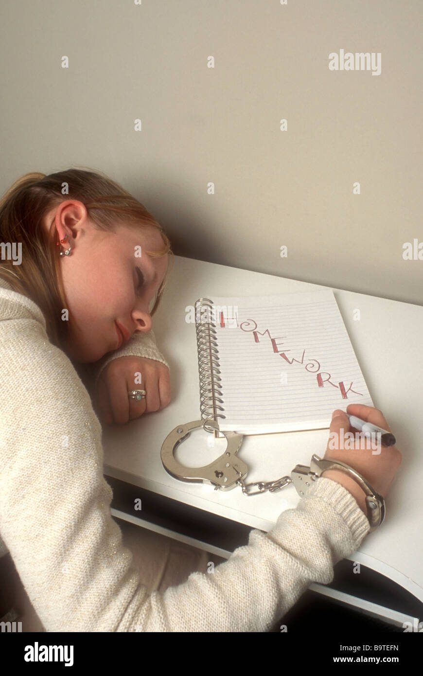 Chained to Homework Stock Photo - Alamy